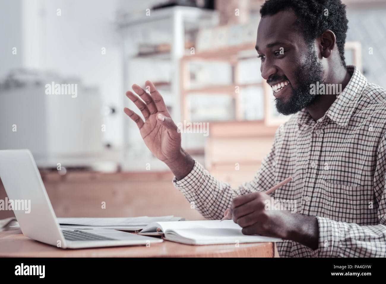 Happy nice man greeting his friend Stock Photo - Alamy