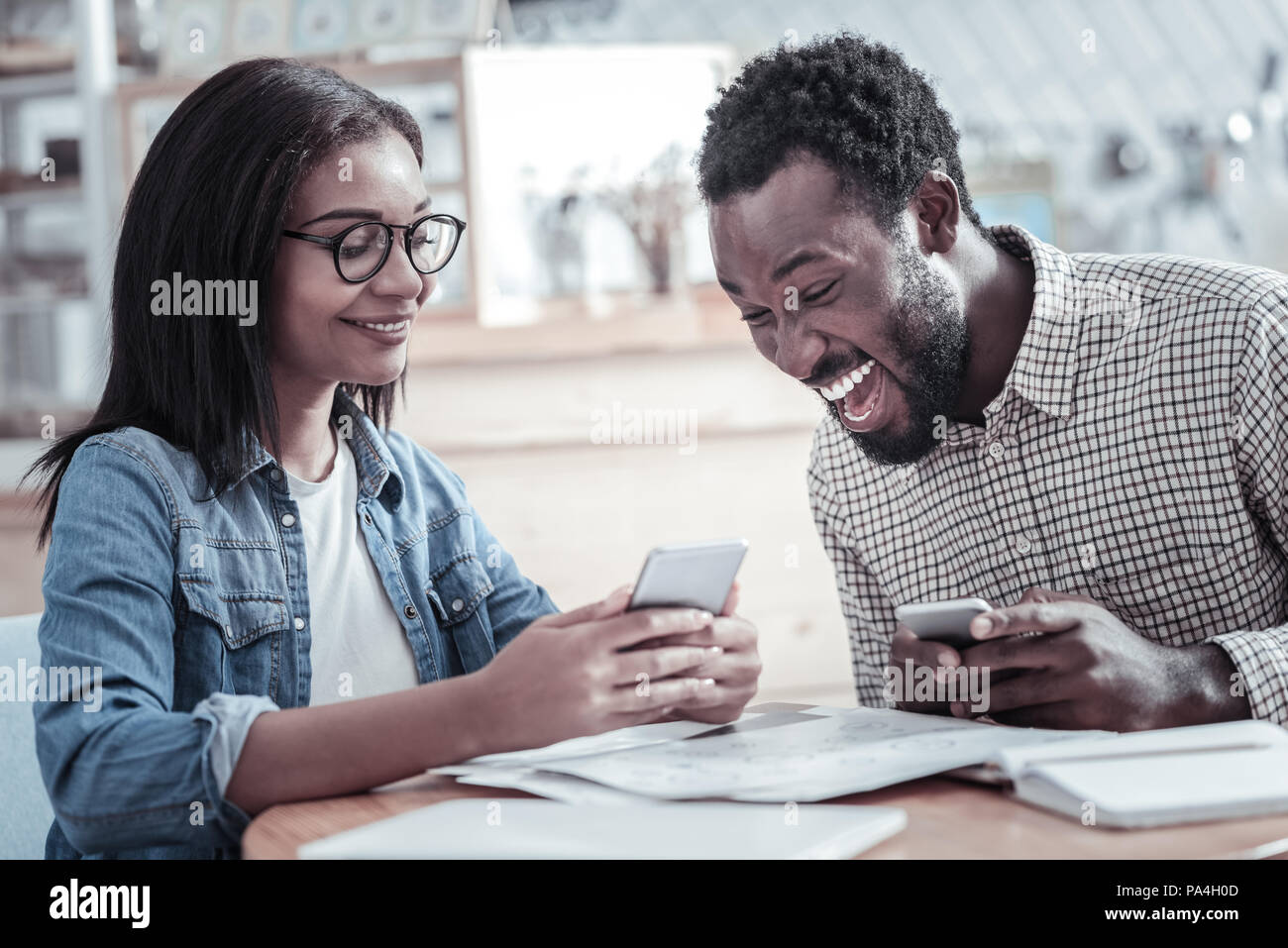 Happy positive man laughing Stock Photo - Alamy