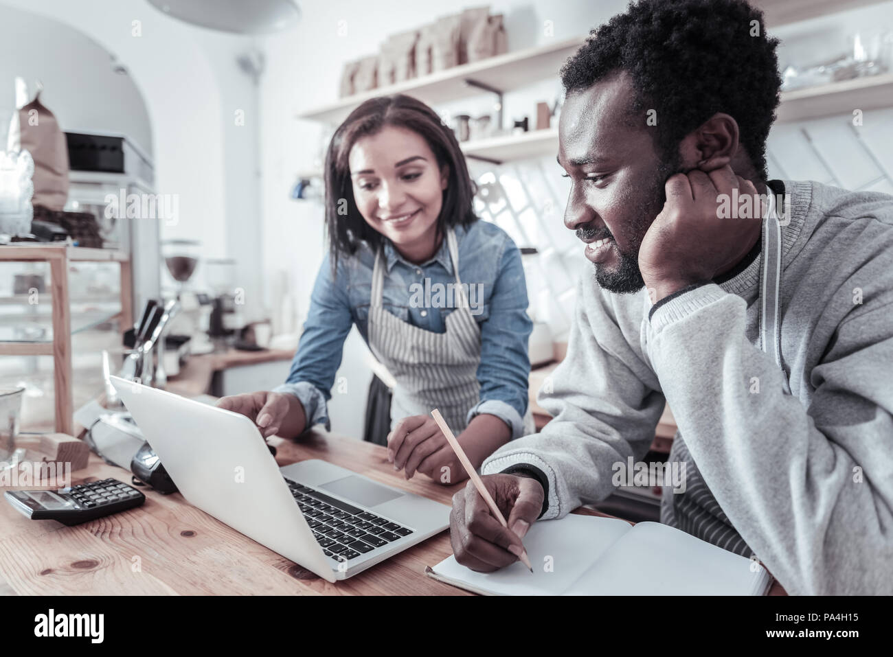 Positive smart man taking notes Stock Photo - Alamy