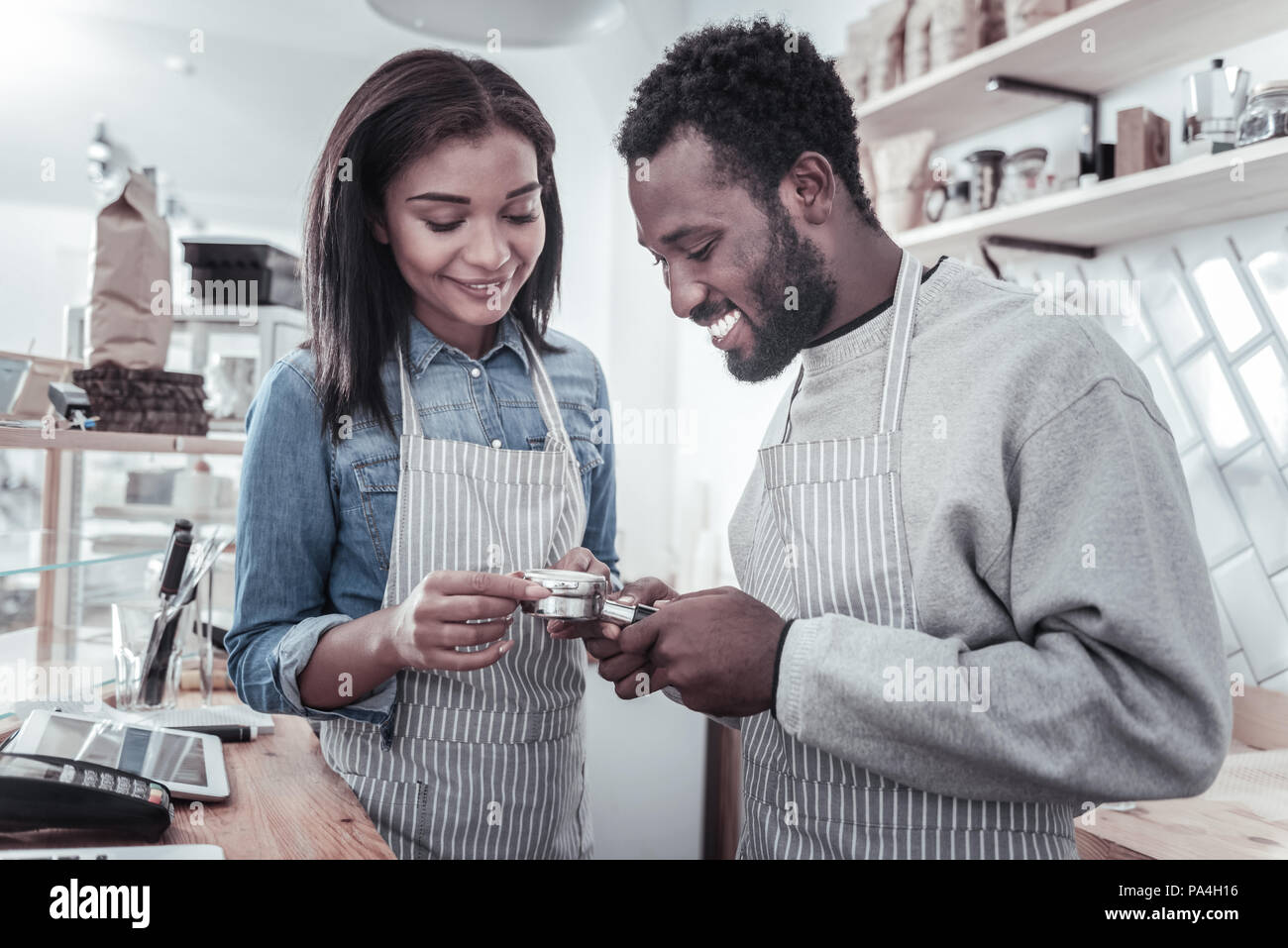 Nice positive colleagues standing together Stock Photo - Alamy