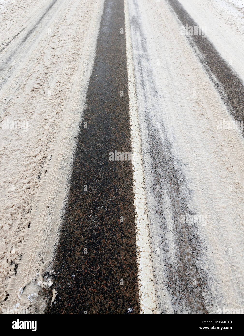 Traces of cars on the asphalt road in the winter season, close-up Stock ...