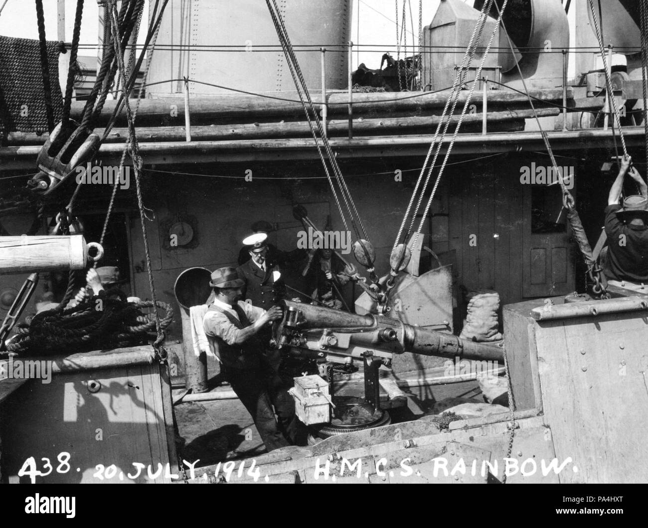52 Civilian inspects gun aboard HMCS Rainbow Vancouver 1914 Stock Photo ...