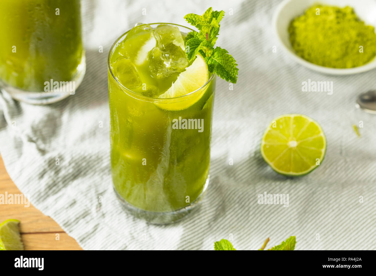Raw Green Organic Matcha Iced Tea Detox with Lime and Mint Stock Photo ...