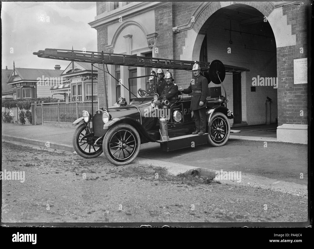 83 Firemen and a fire engine outside Petone Fire Station ATLIB 286465 ...