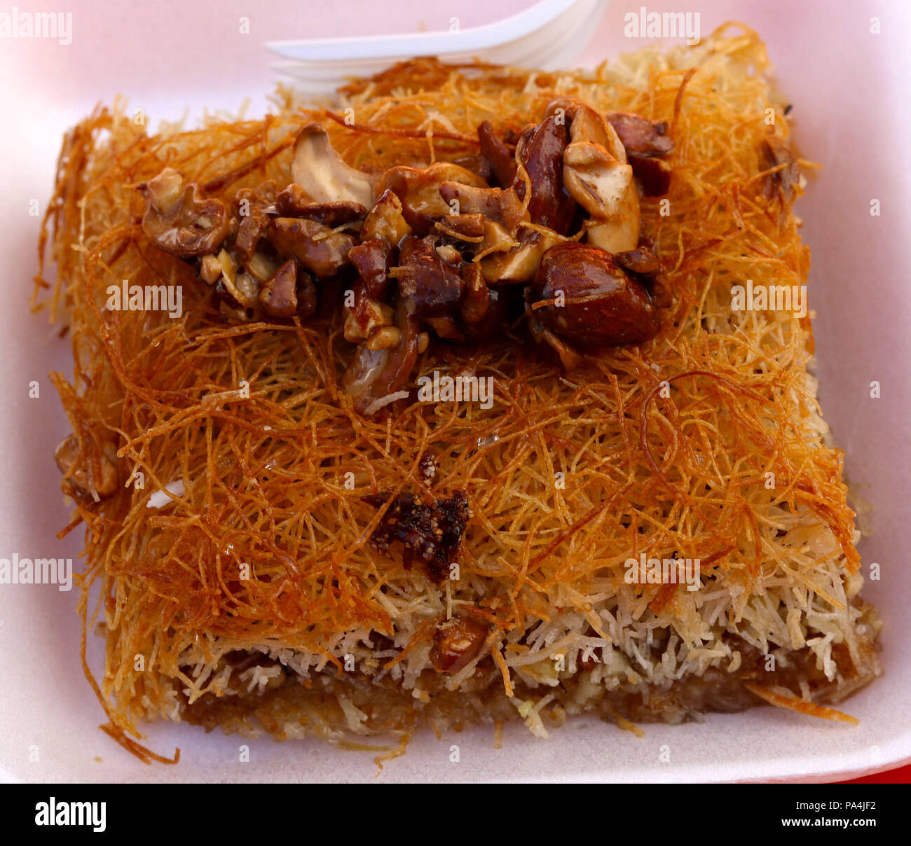 Kanafeh, a Palestinian dessert made with noodle-like pastry and layered ...