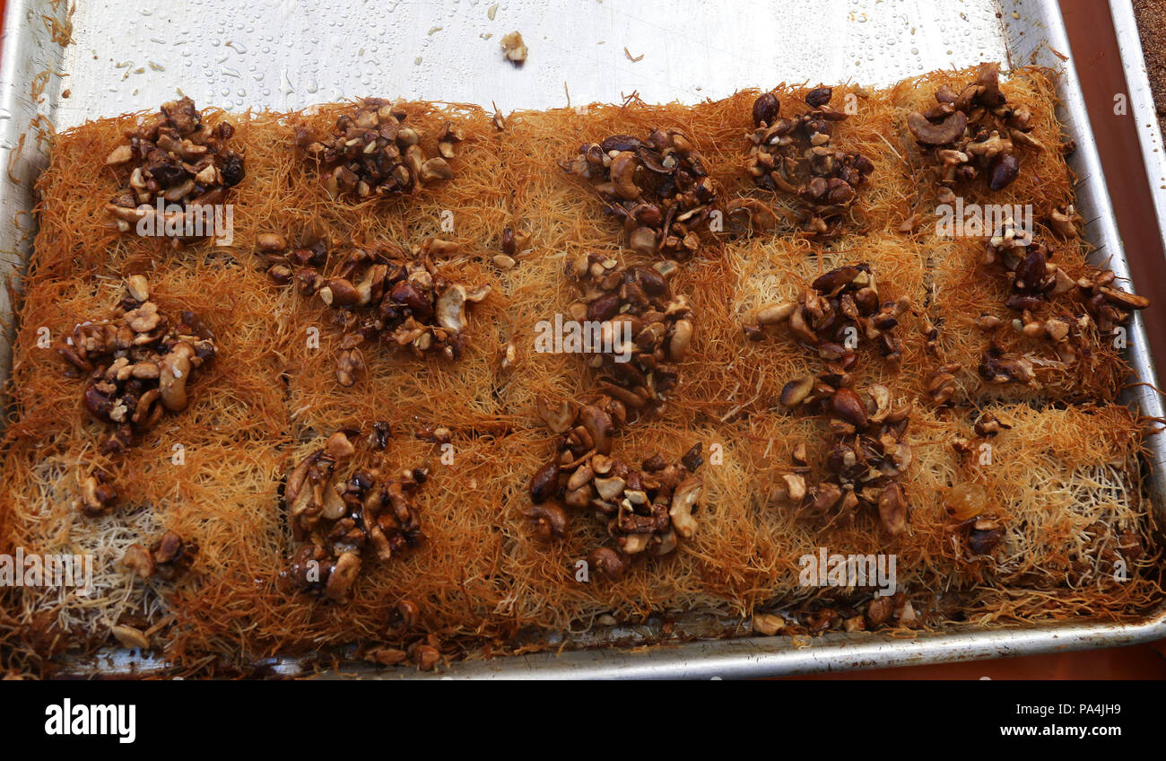 Kanafeh, a Palestinian dessert made with noodle-like pastry and layered ...