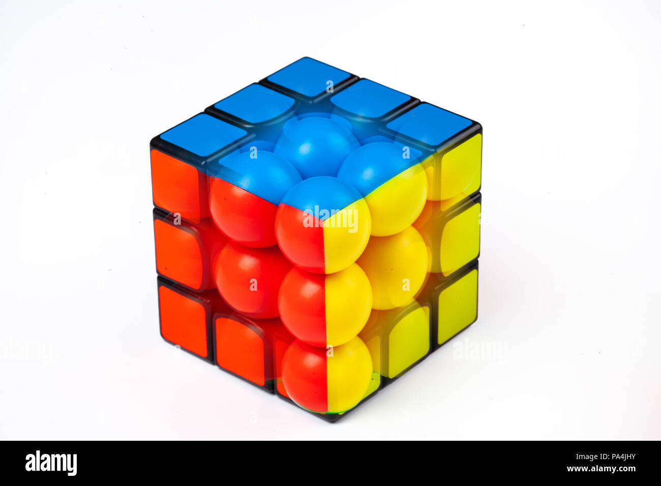 Magic cube on an isolated studio background Stock Photo - Alamy