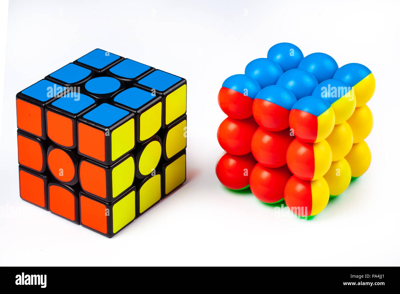 Two magic cubes on an isolated studio background Stock Photo - Alamy