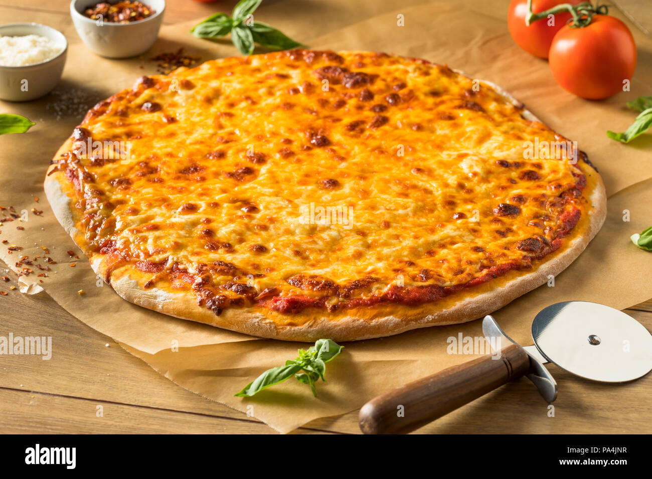 Homemade Greasy New York Cheese Pizza Ready to Eat Stock Photo - Alamy
