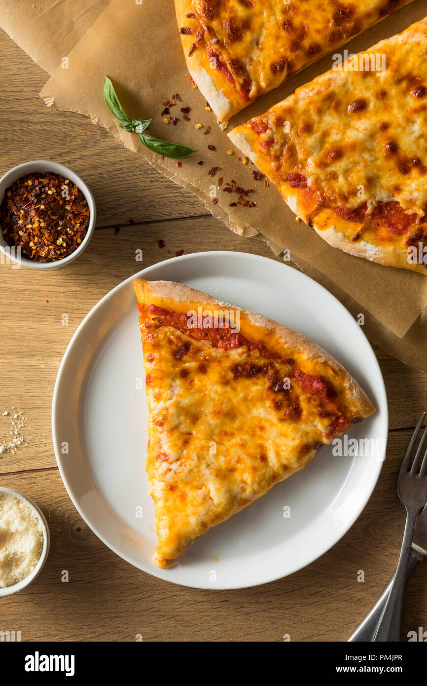 Homemade Greasy New York Cheese Pizza Ready to Eat Stock Photo - Alamy