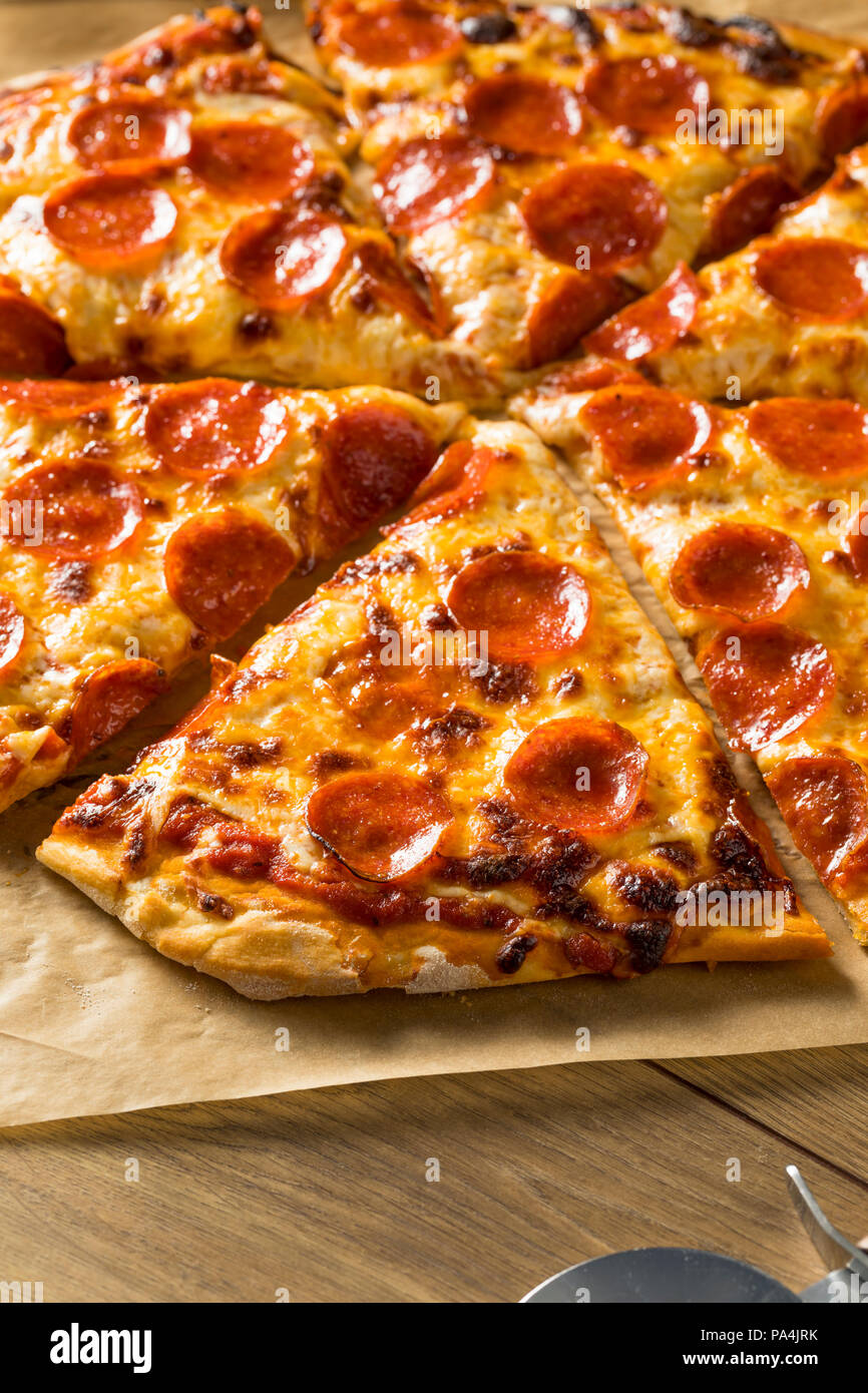 Homemade Greasy Pepperoni New York Pizza Ready to Eat Stock Photo - Alamy