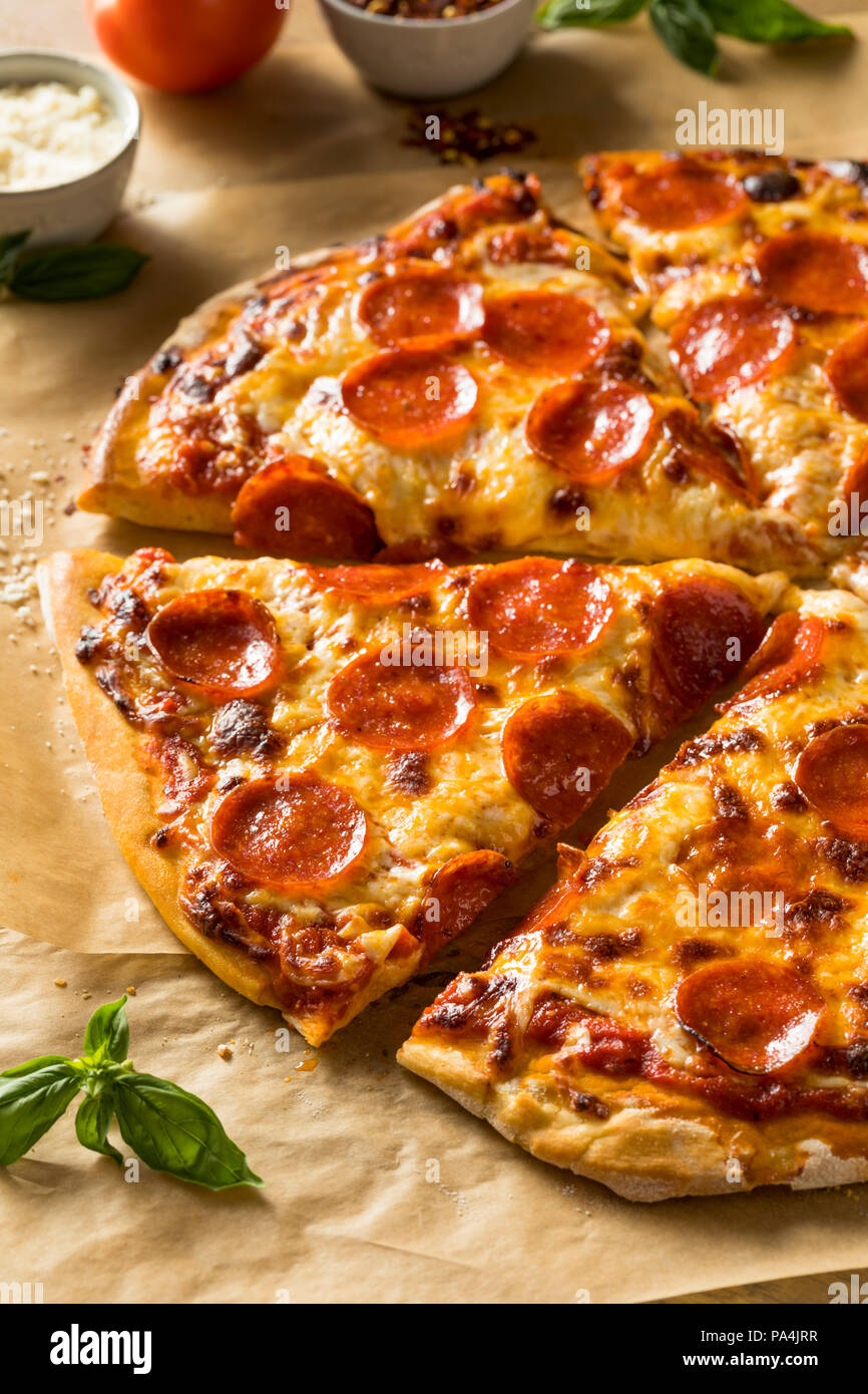 Homemade Greasy Pepperoni New York Pizza Ready to Eat Stock Photo - Alamy