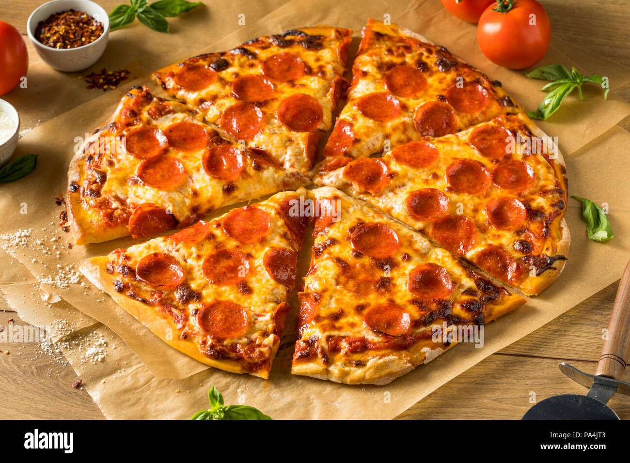 Homemade Greasy Pepperoni New York Pizza Ready to Eat Stock Photo - Alamy