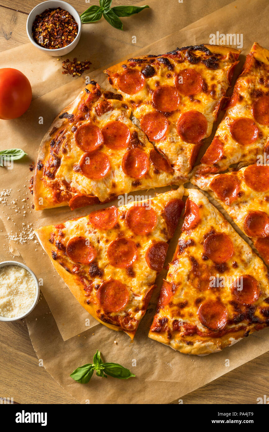 Homemade Greasy Pepperoni New York Pizza Ready to Eat Stock Photo - Alamy