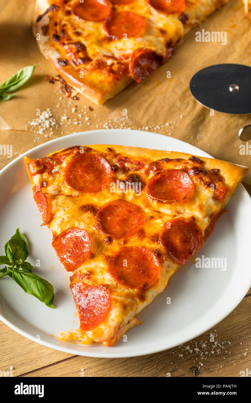 Homemade Greasy Pepperoni New York Pizza Ready to Eat Stock Photo - Alamy