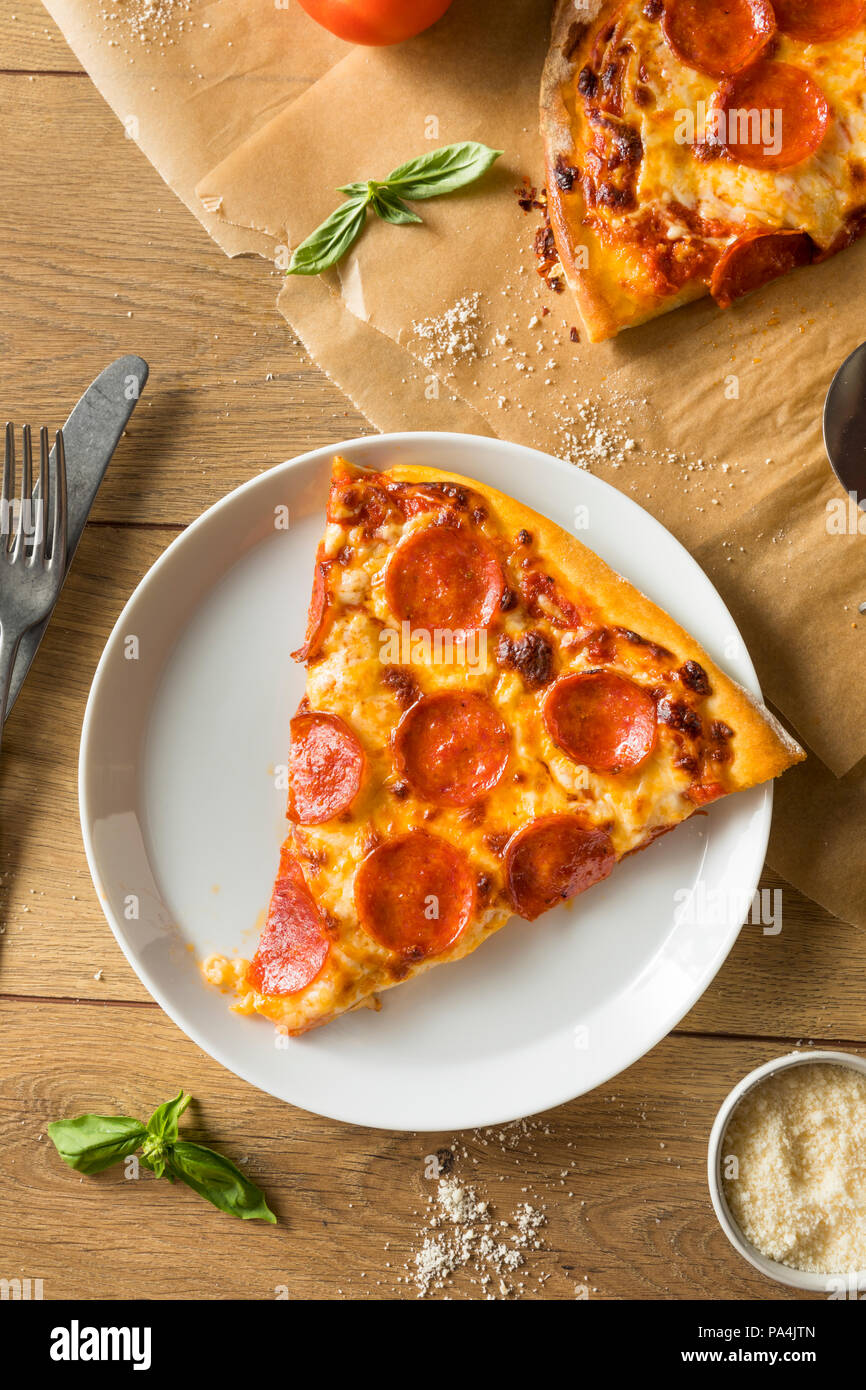 Homemade Greasy Pepperoni New York Pizza Ready to Eat Stock Photo - Alamy