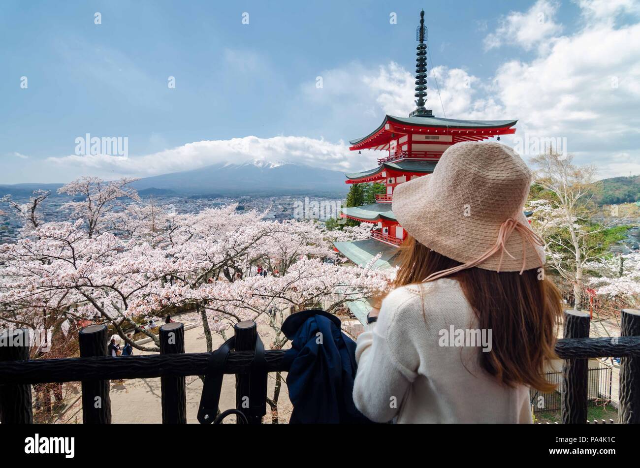 Portrait of sweet and beautiful Asian girl admiring the majestic Mount ...