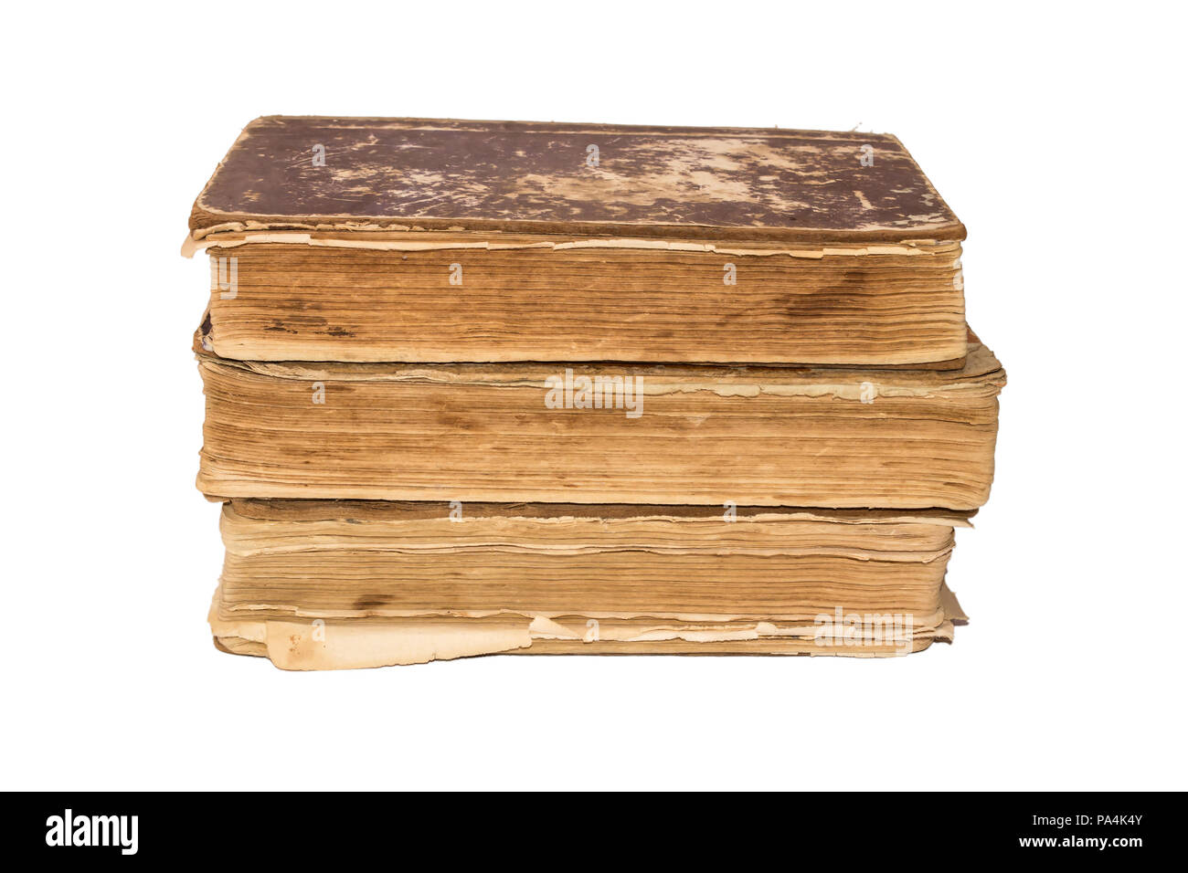 A stack of old tattered books. Vintage torn books. Antiques isolated ...