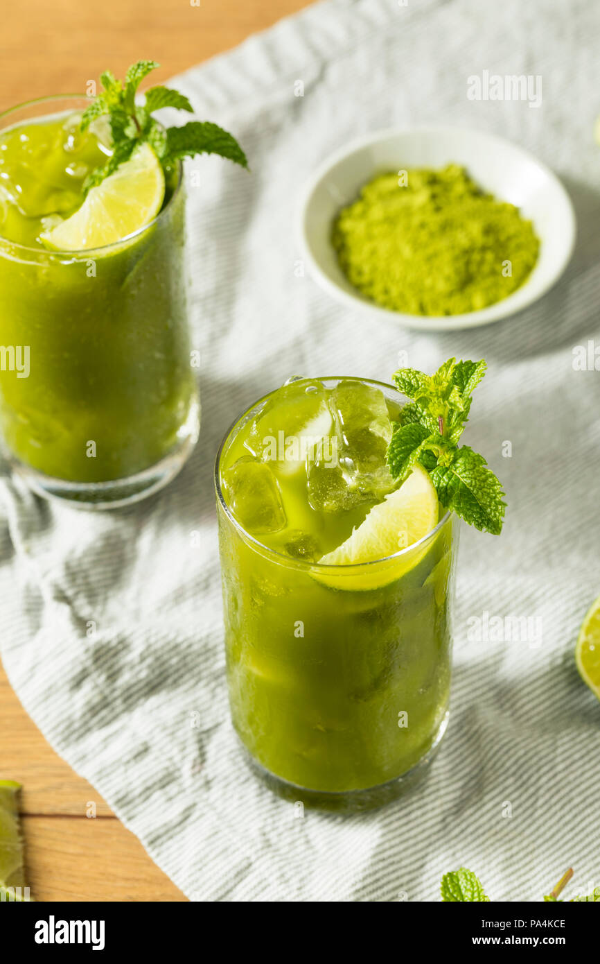 Raw Green Organic Matcha Iced Tea Detox with Lime and Mint Stock Photo ...