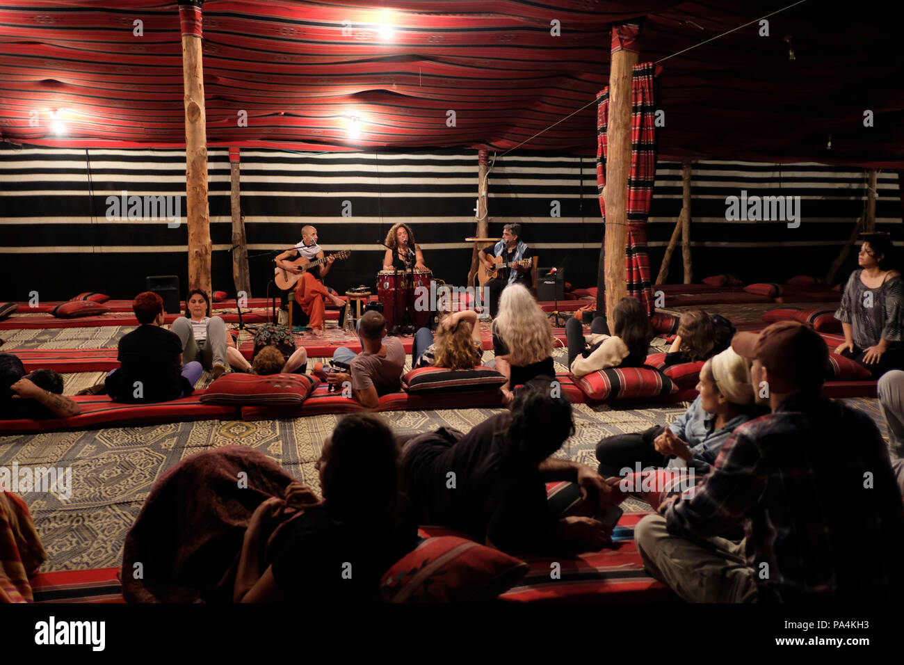 Hikers enjoying musical entertainment under a Bedouin tent in Be’erot ...