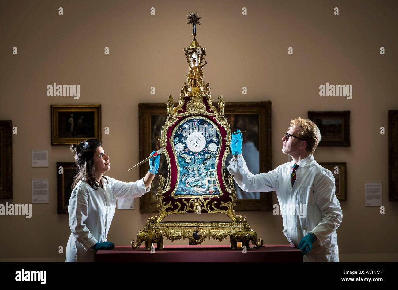 Horology conservators Daniela Corda and Matthew Read as a highly ornate ...