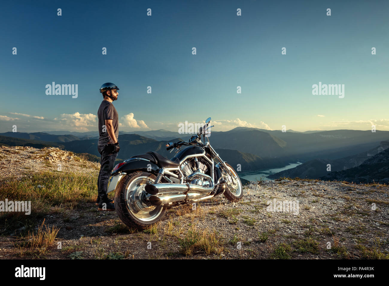 Guy standing motorcycle hi-res stock photography and images - Alamy