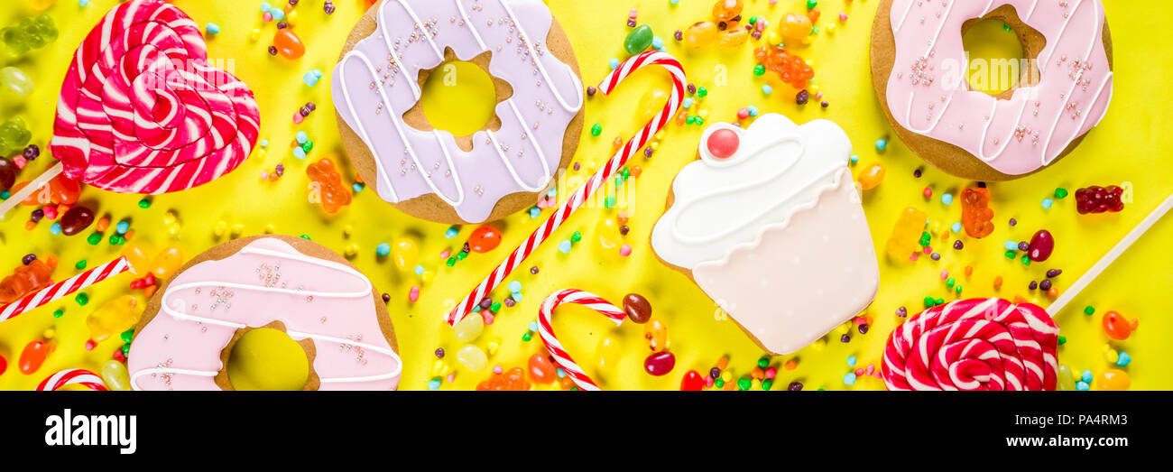 Sweets creative lay out, dessert concept with lollipops, jellies, candy ...