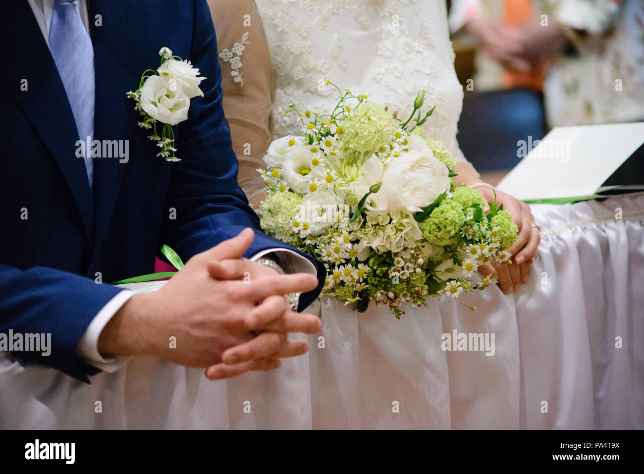 spouses in the church pray during the wedding celebration Stock Photo ...