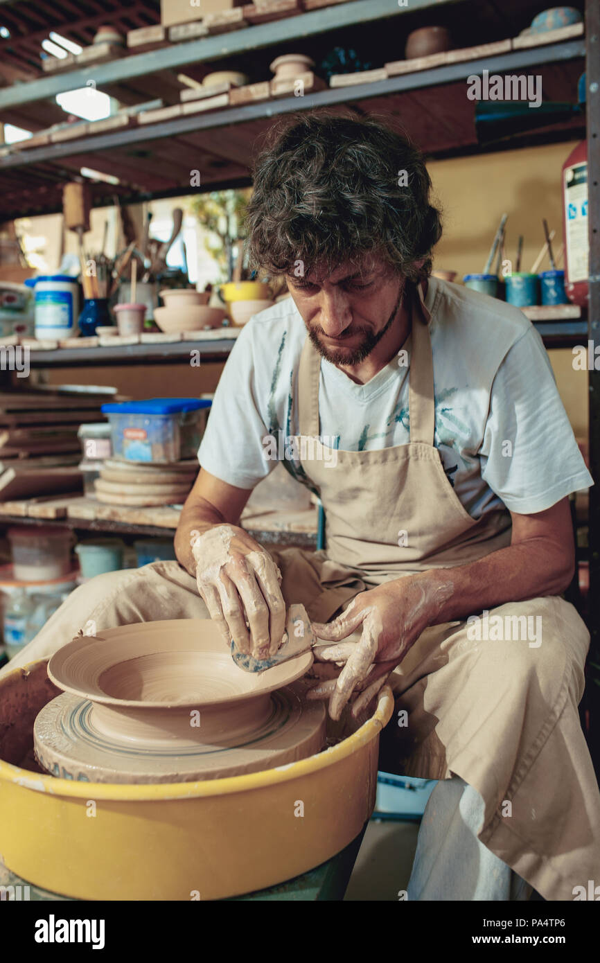 Creating a jar or vase of white clay close-up. Master crock Stock Photo ...