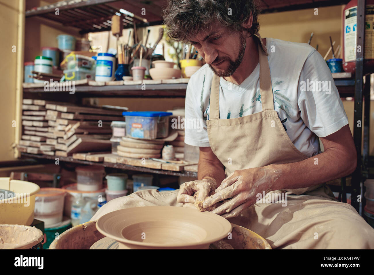 Creating a jar or vase of white clay close-up. Master crock Stock Photo ...