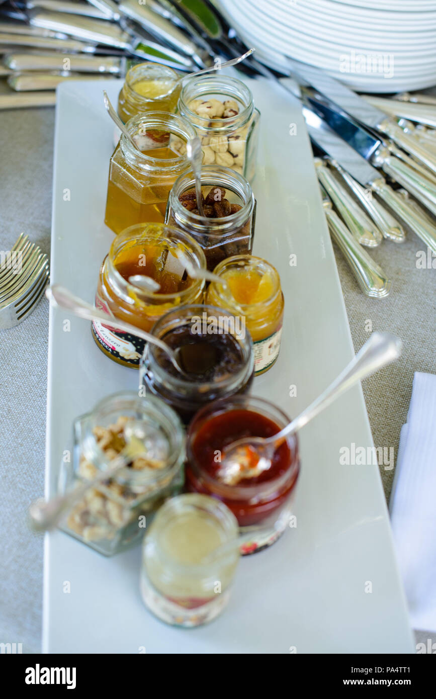 tray with jars of different types of jams Stock Photo - Alamy