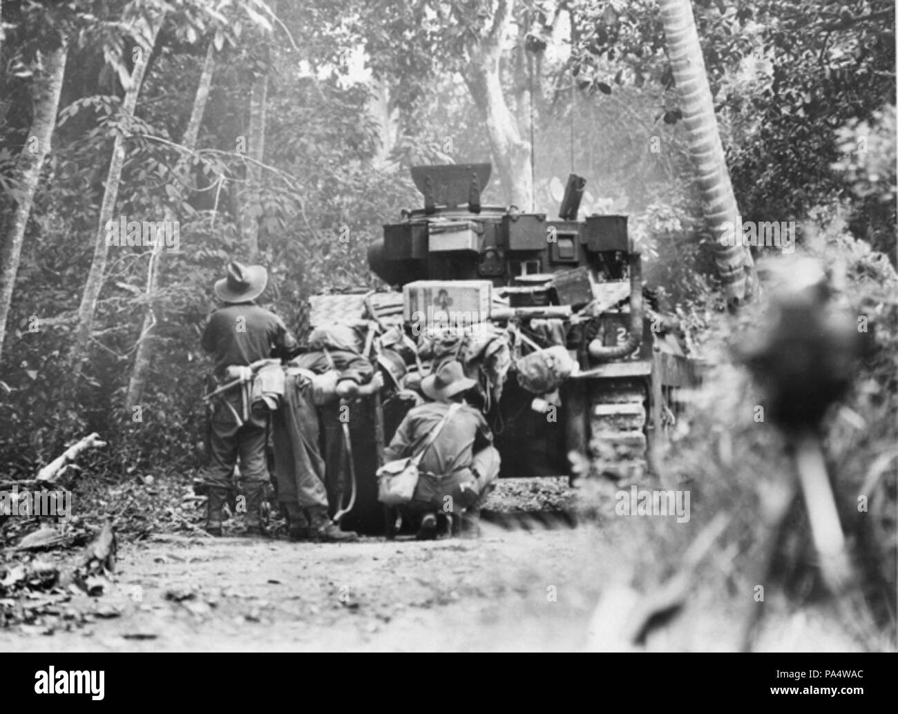 26 Australian soldiers taking cover behind a tank on Labuan Stock Photo ...