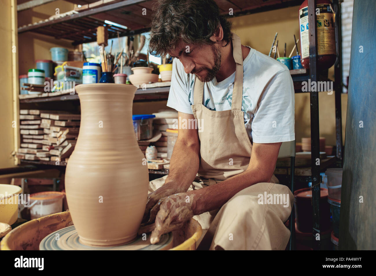 Creating a jar or vase of white clay close-up. Master crock Stock Photo ...