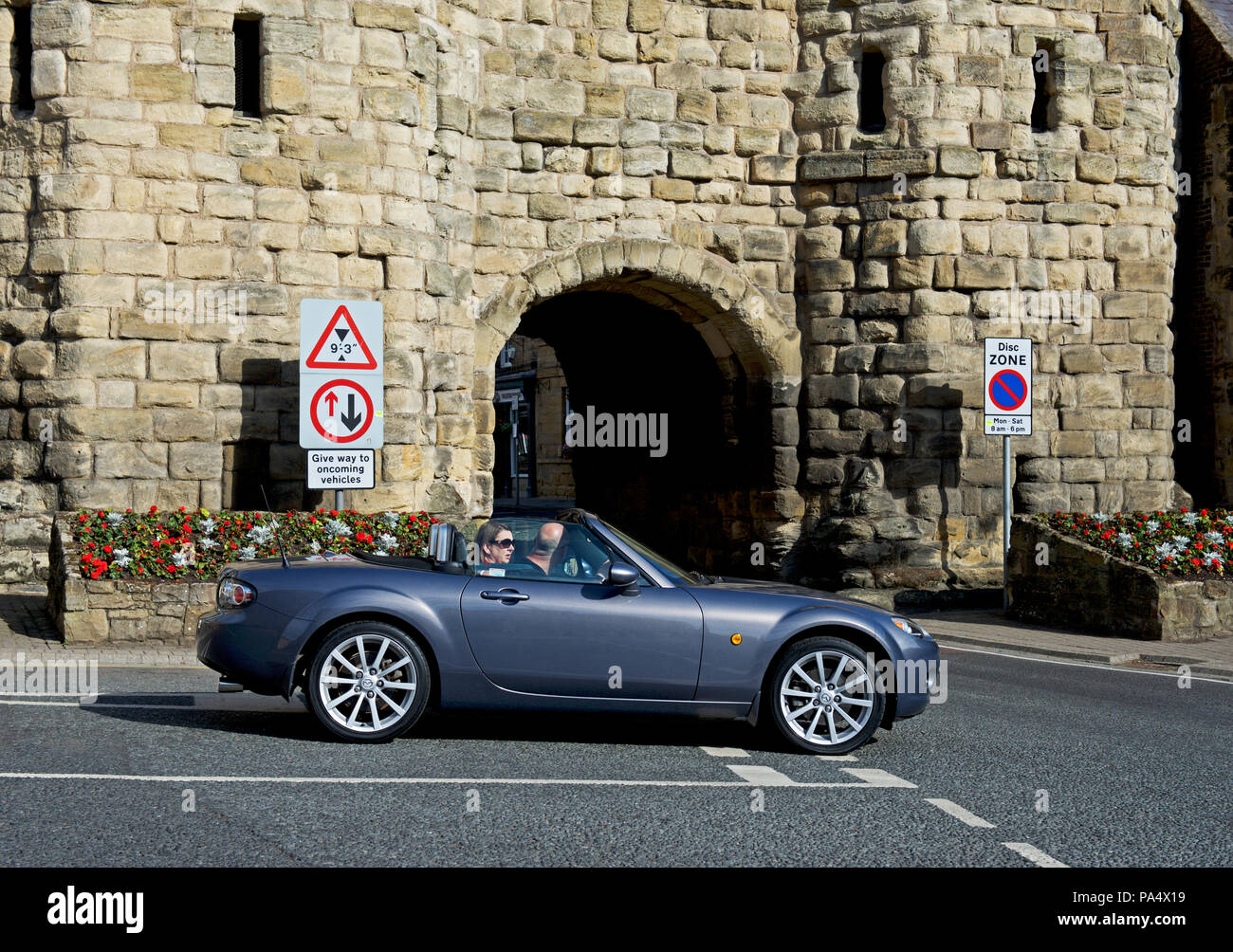 Sports car, Bondgate Tower, Alnwick, Northumberland, England UK Stock ...