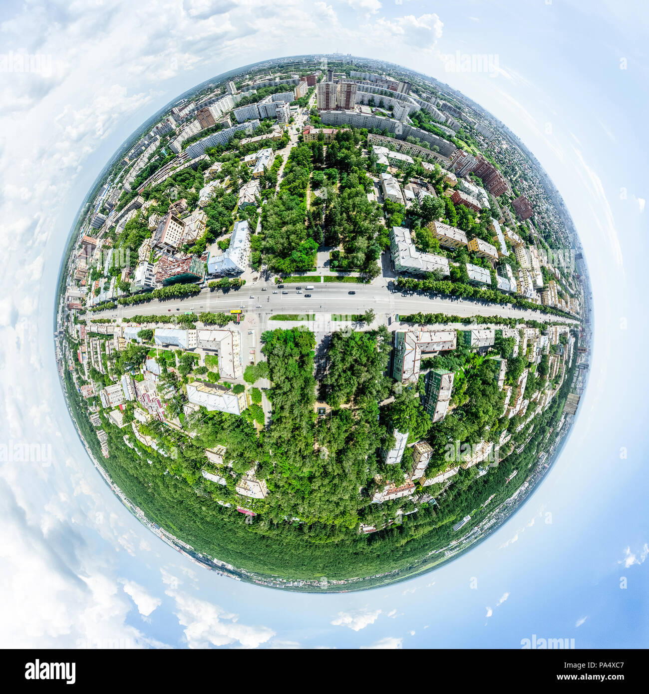 Aerial city view with crossroads and roads, houses, buildings, parks ...