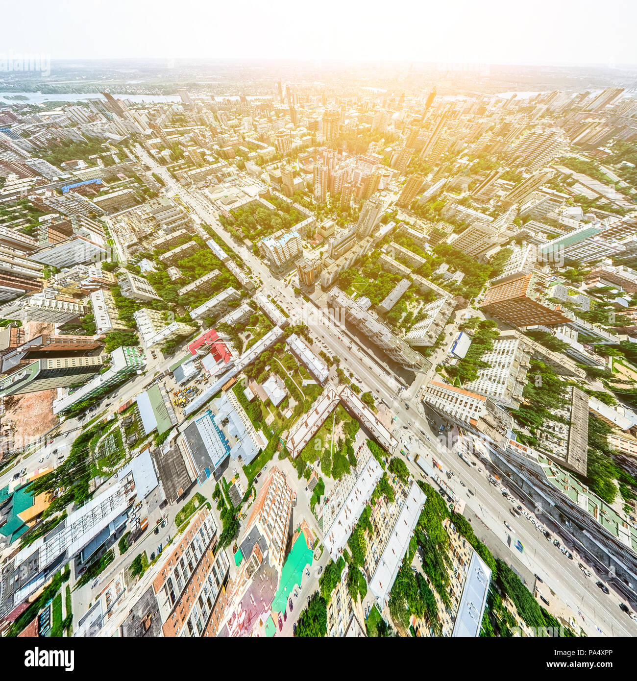 Aerial city view with crossroads and roads, houses, buildings, parks ...