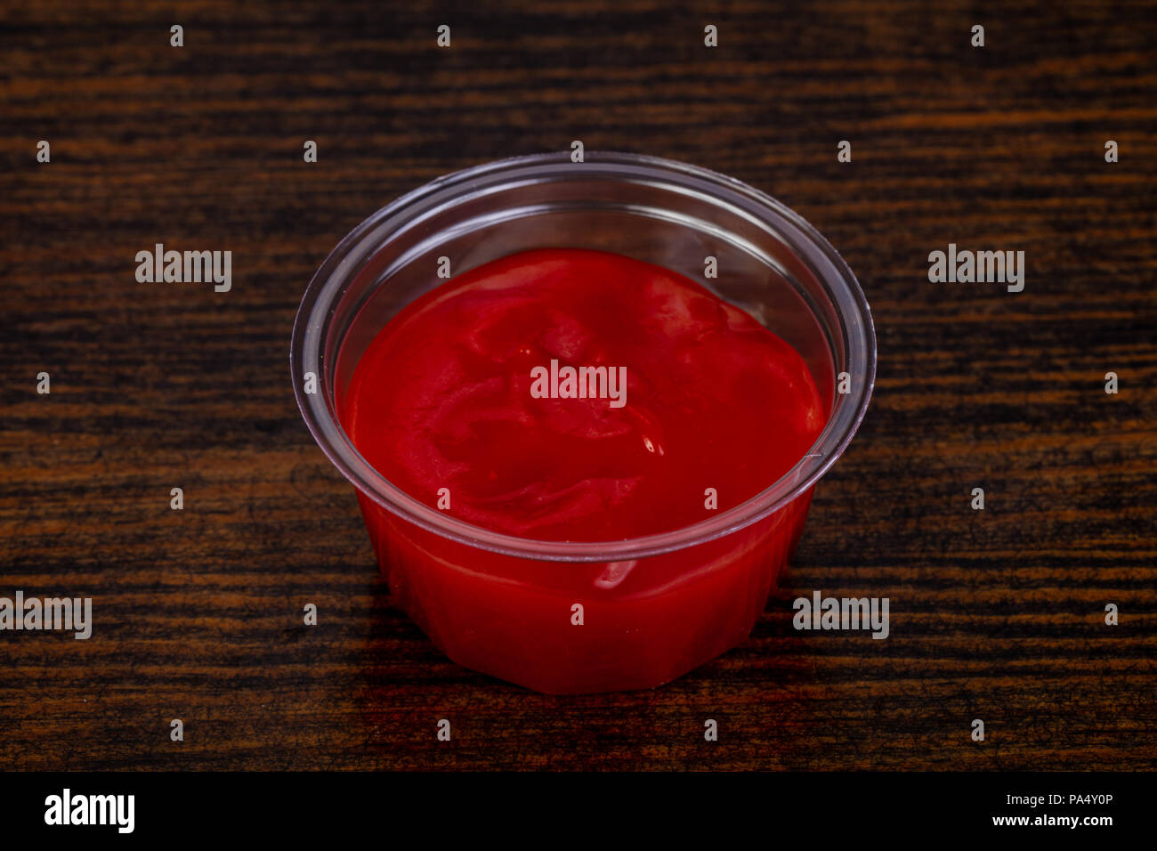 Ketchup sauce portion over wooden Stock Photo - Alamy