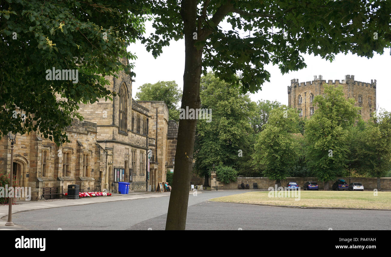 Tourists walking around sightseeing the Castle on Palace Green Durham ...