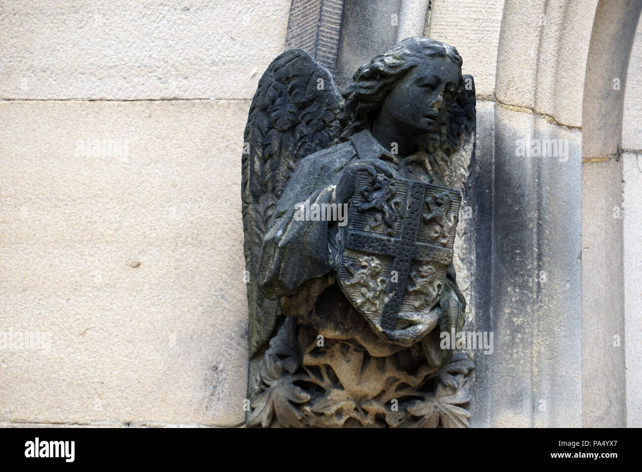 Ancient Stone Statue Sculpture on the stone wall of Durham Cathedral ...