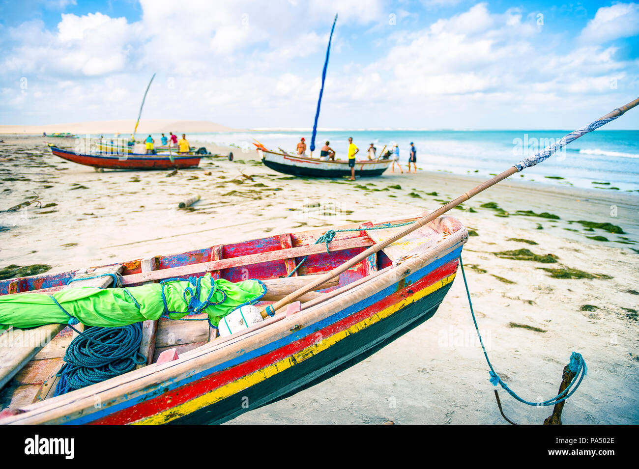 Traditional colorful Brazilian fishing boat on the beach in ...