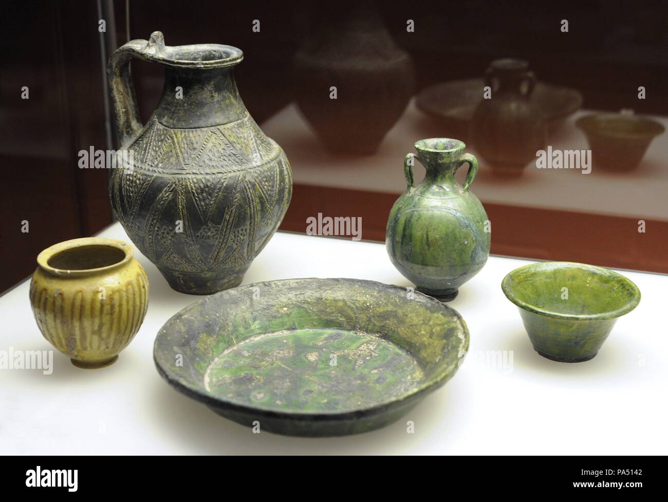Set of Roman ceramic objects in green and yellow. From Cologne ...