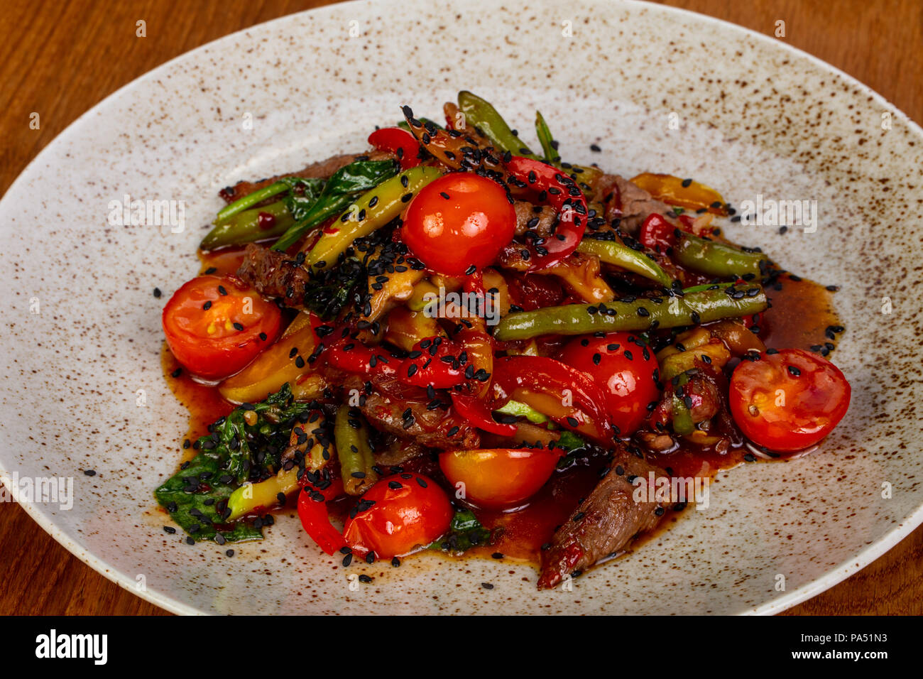 Beef with tomato and herbs Stock Photo - Alamy