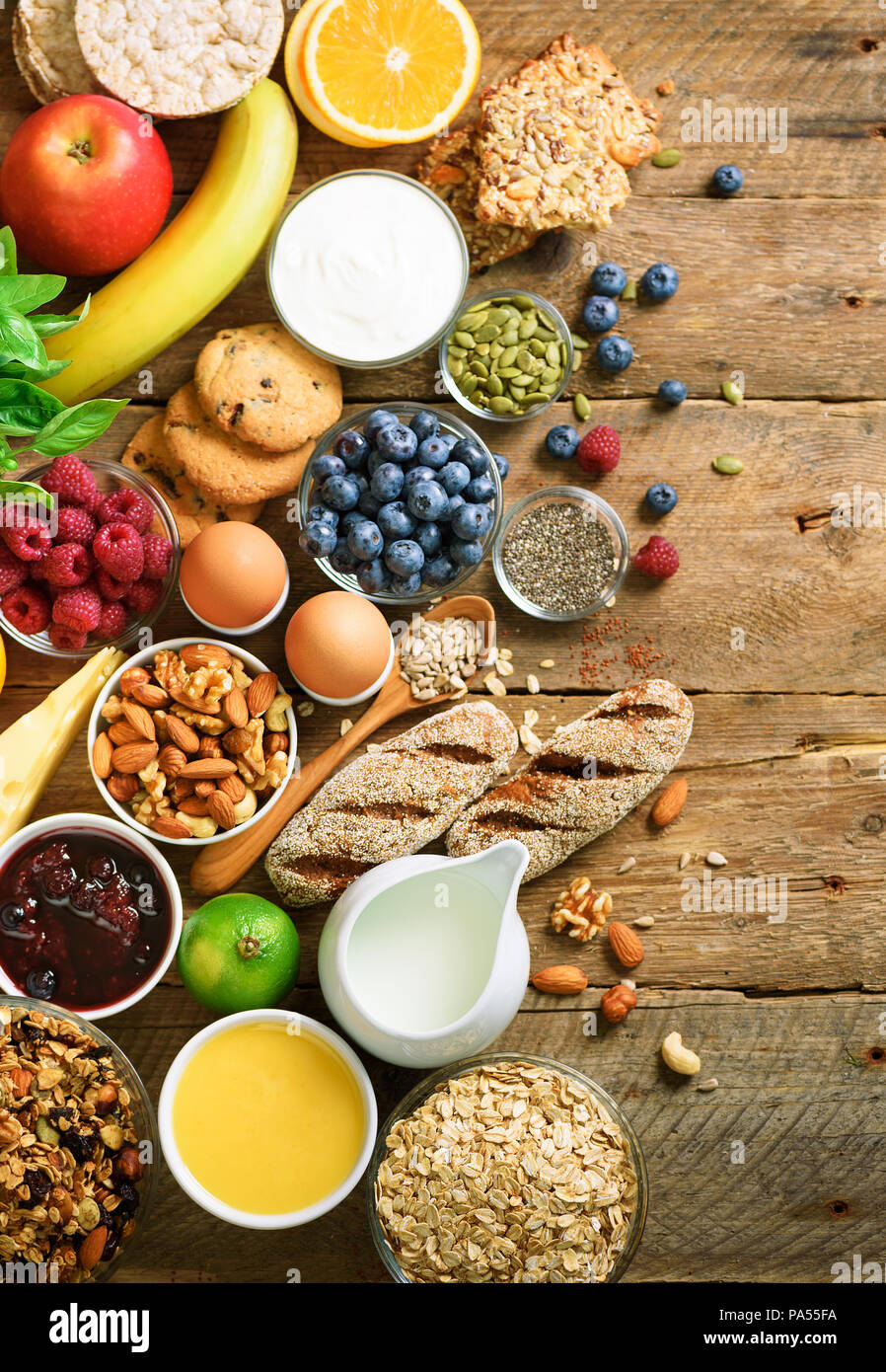 Healthy breakfast ingredients, food frame. Granola, egg, nuts, fruits ...