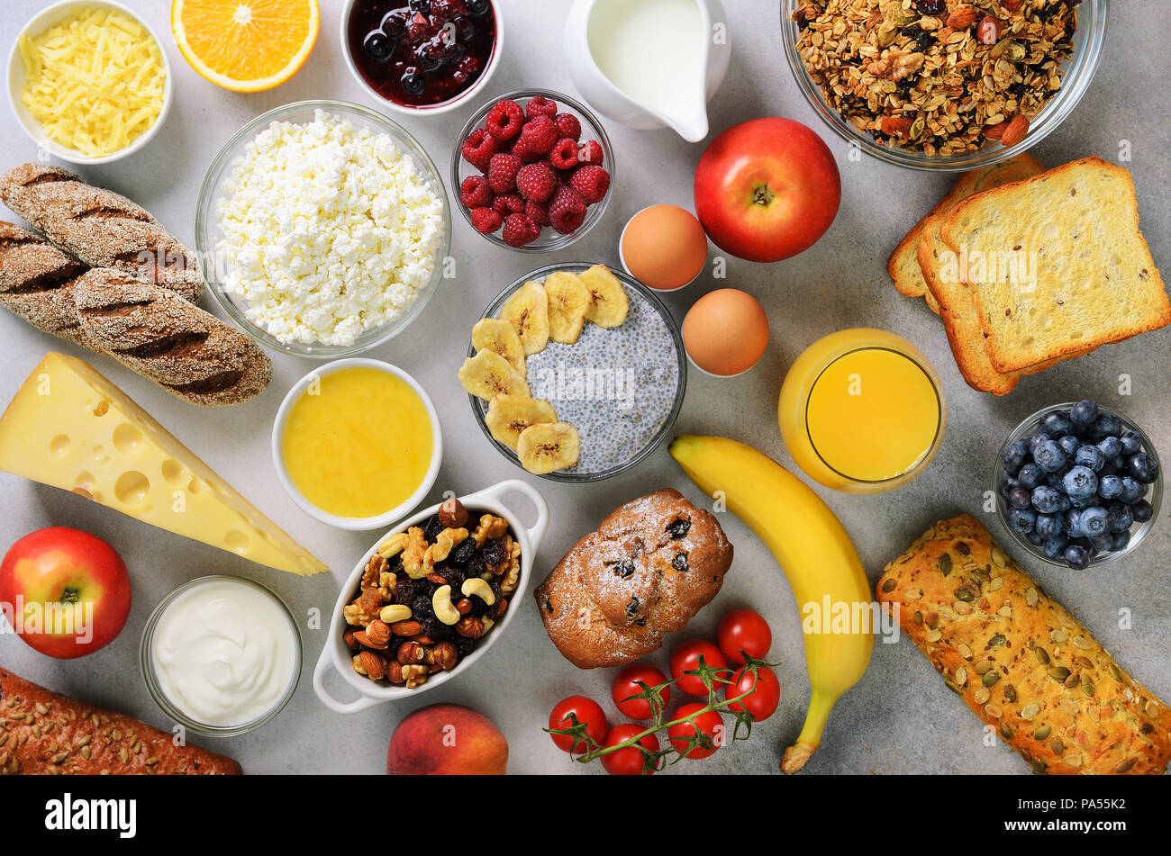 Healthy breakfast ingredients, food frame. Granola, egg, nuts, fruits ...