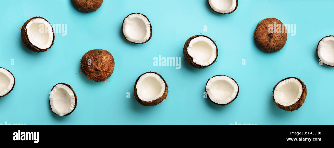 Pattern with ripe coconuts on blue background. Top View. Copy Space ...