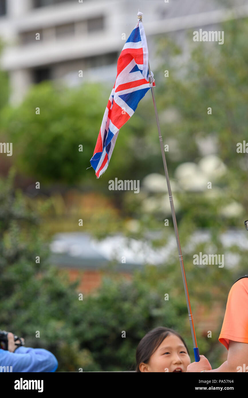 Flag symbol held (outside Queens' college) by the tour leader of a ...