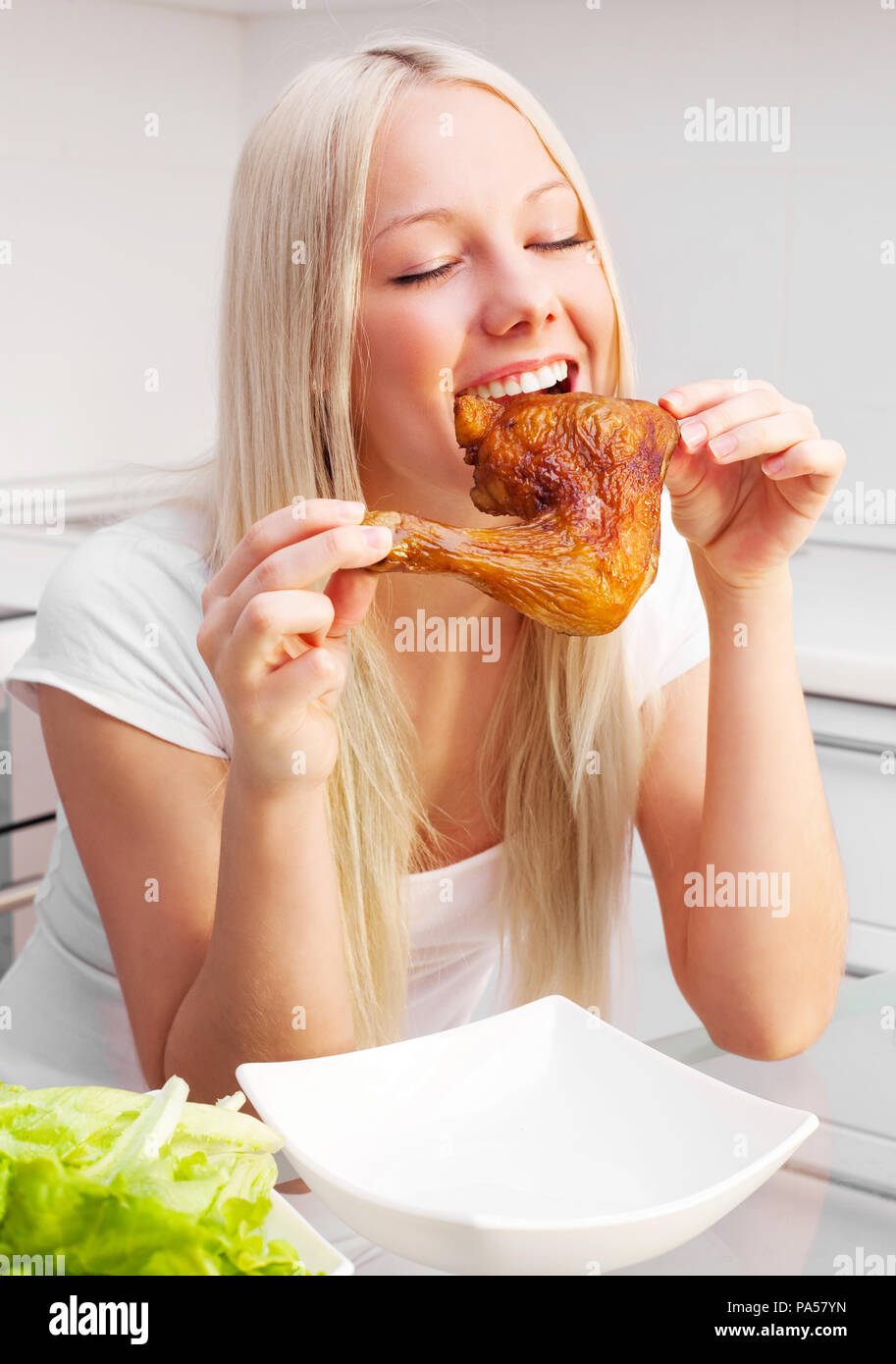 Woman alone eating chicken hi-res stock photography and images - Alamy