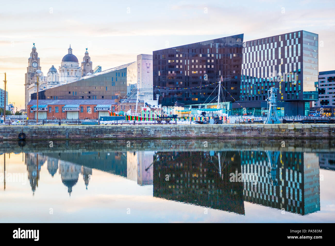 Dusk shot of Liverpool Waterfront, showing water reflection of Mann ...