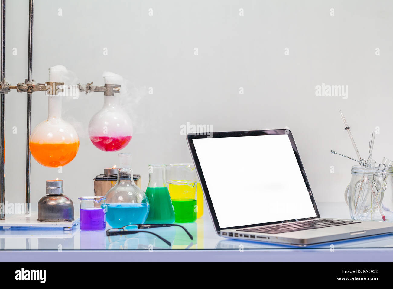 a scientist work on computer in chemical mixing in laboratory ...