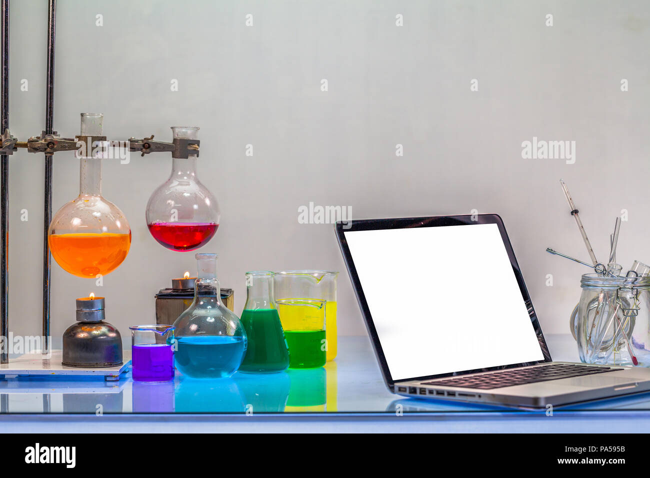 a scientist work on computer in chemical mixing in laboratory ...